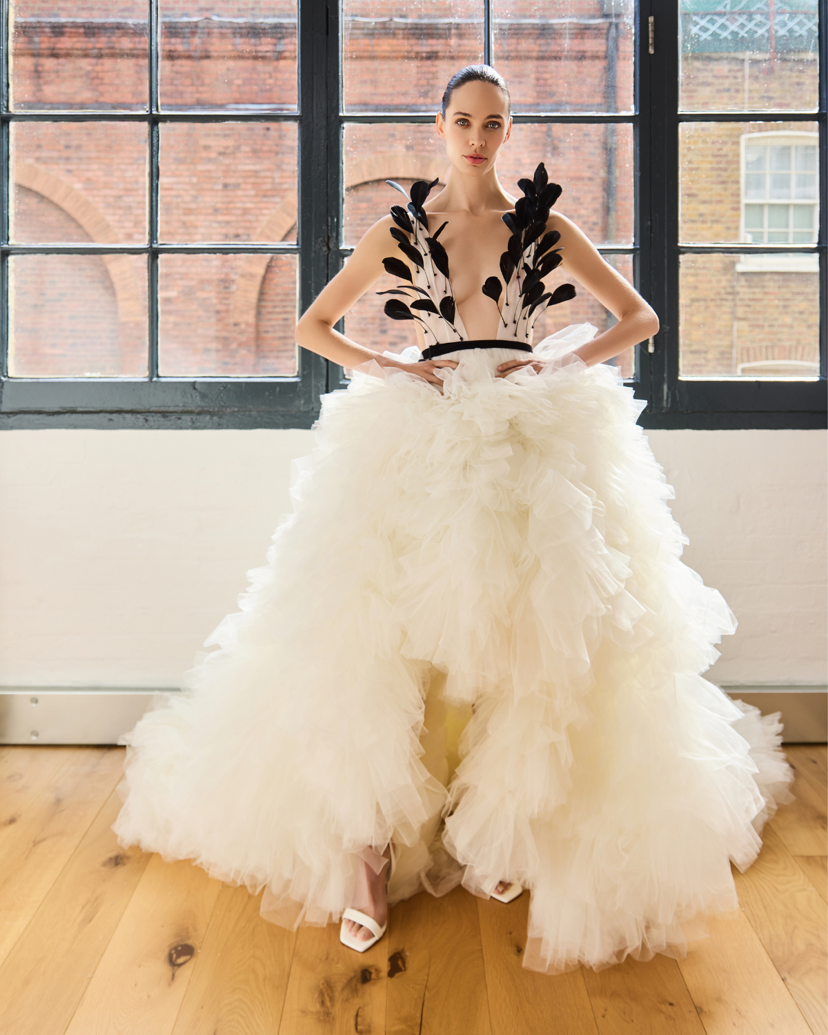 Edi Crystal Feather Plunge Tulle Ruffle Wedding Gown with Velvet Belt